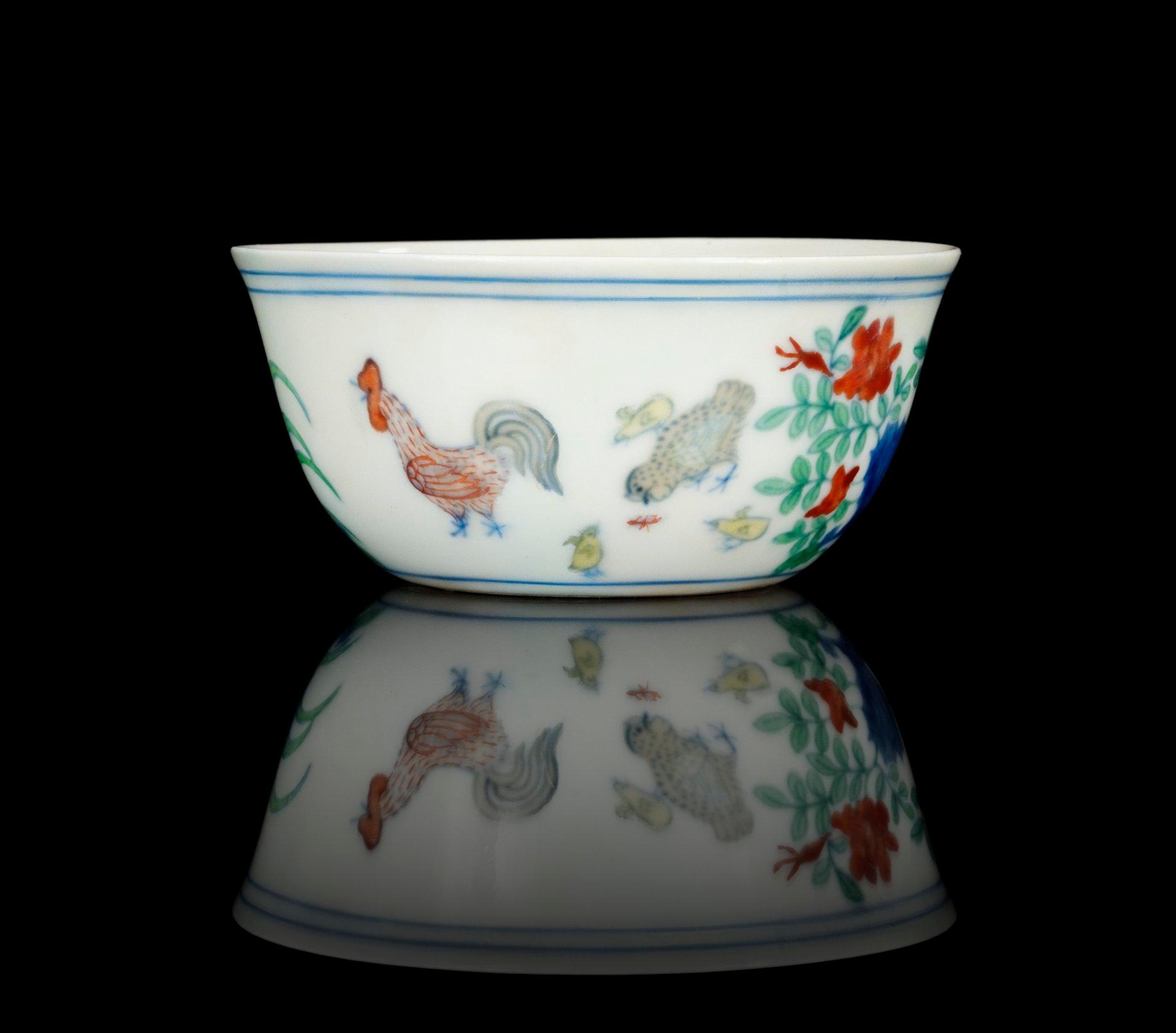 A rare doucai 'Chicken' cup, Ming dynasty, six character mark and ...
