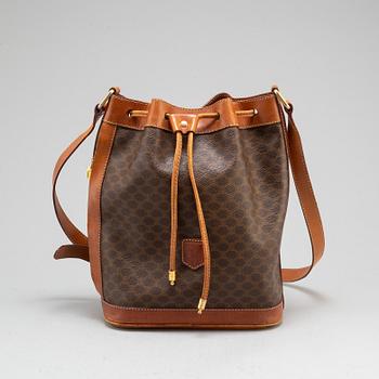 CÉLINE, a monogram canvas bucket bag. - Bukowskis