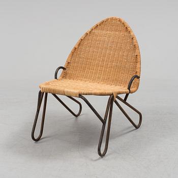 A rattan easy chair, 1950's. - Bukowskis