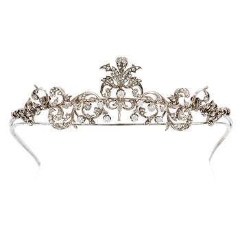 An 18K gold and silver tiara composed of scroll motifs set with old ...