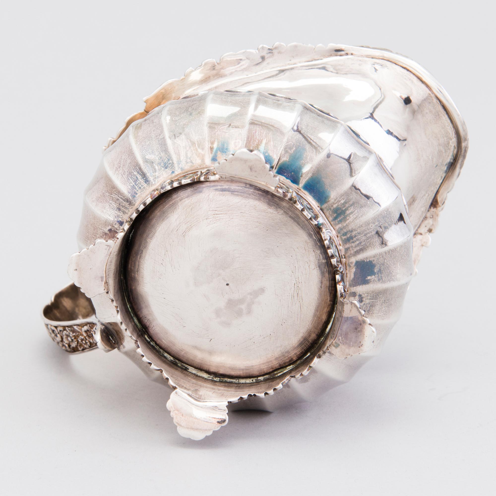 REBECCA EMES & EDWARD BARNARD I, A parcel-gilt milk jug, London 1822 ...