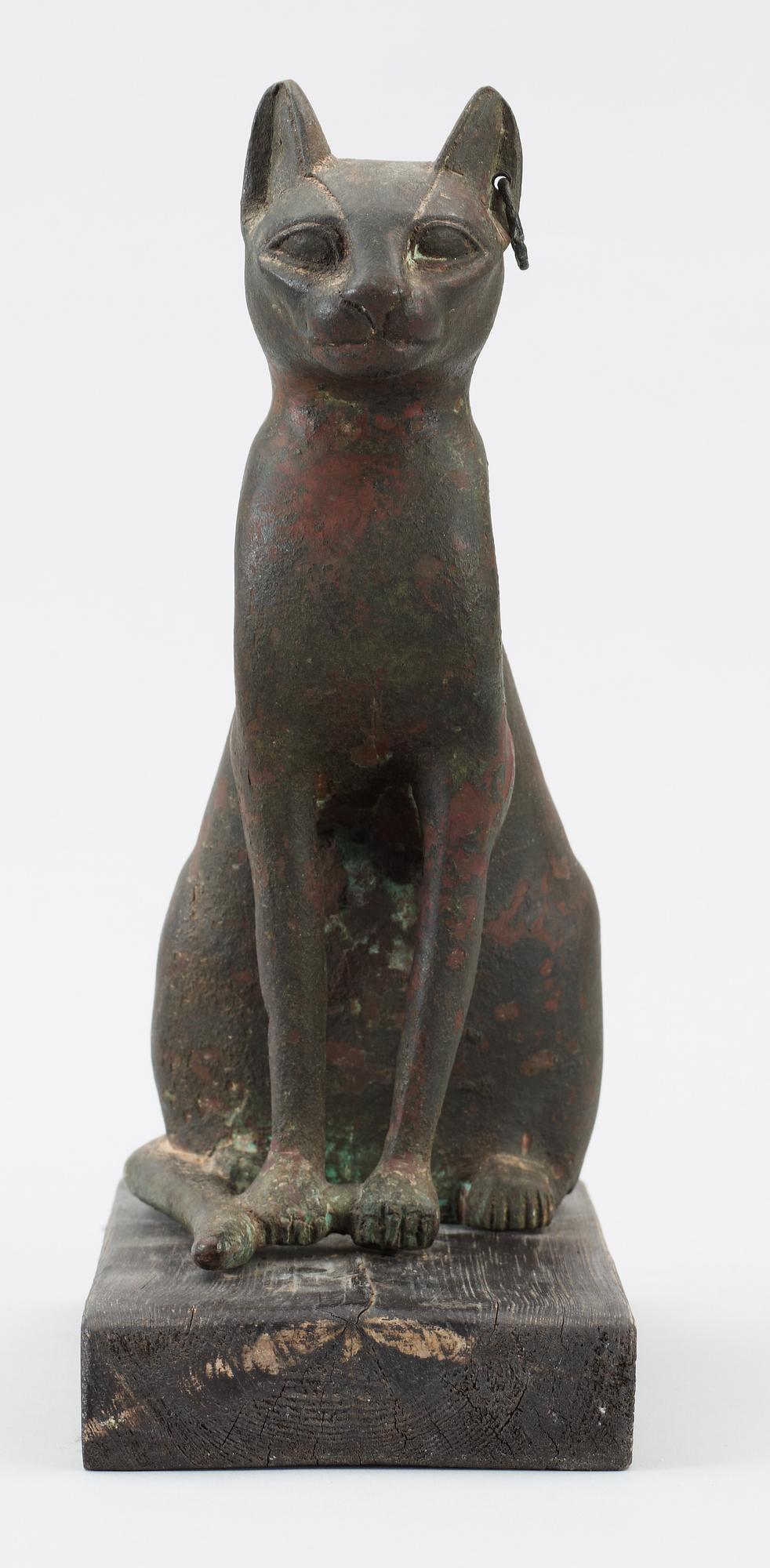 A bronze cat statuette, Egypt, possibly 22-30 Dynasty, 945-332 BC ...
