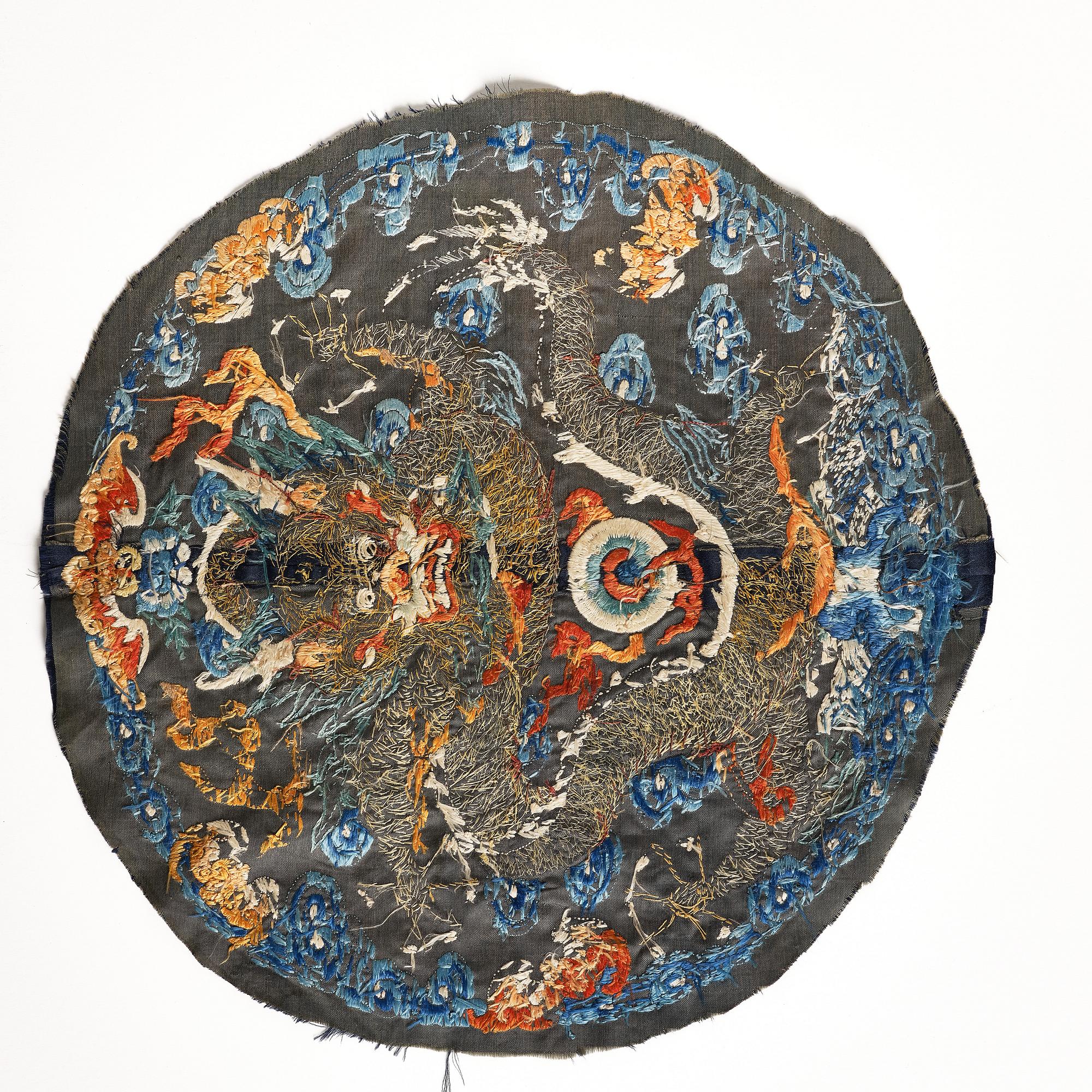 An embroidered dragon roundel from the surcoat of an Emperor or ...