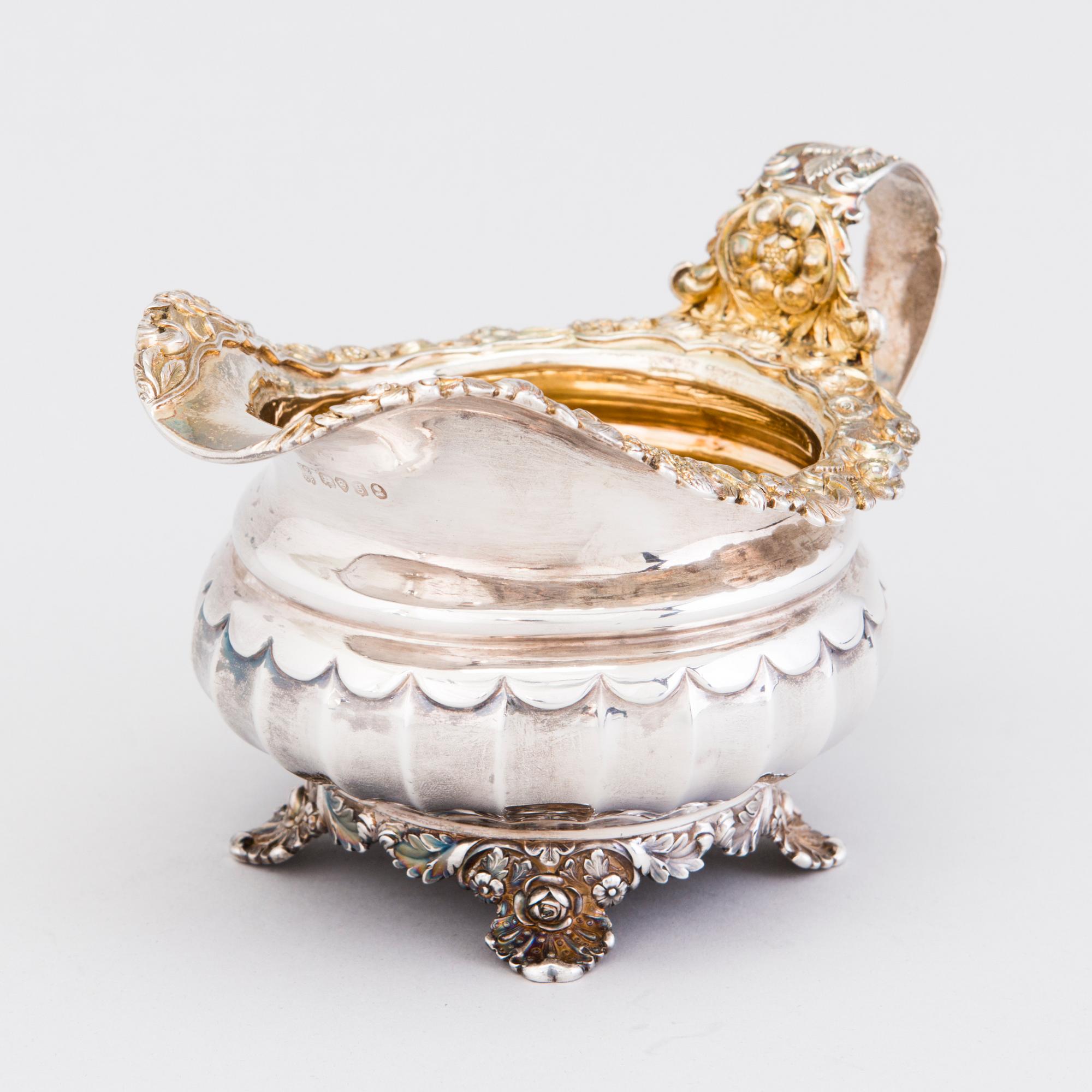 REBECCA EMES & EDWARD BARNARD I, A parcel-gilt milk jug, London 1822 ...