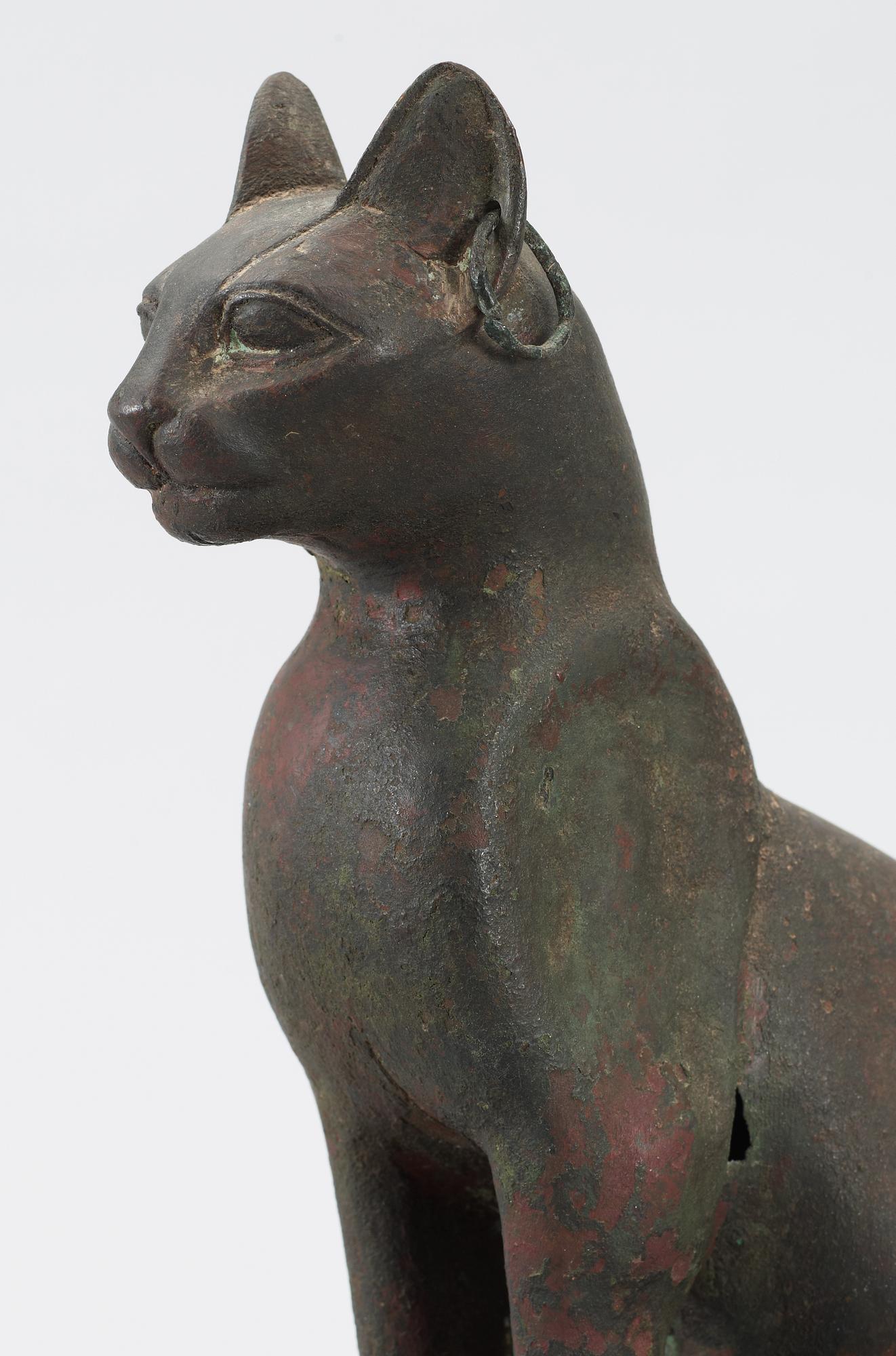 A bronze cat statuette, Egypt, possibly 22-30 Dynasty, 945-332 BC ...