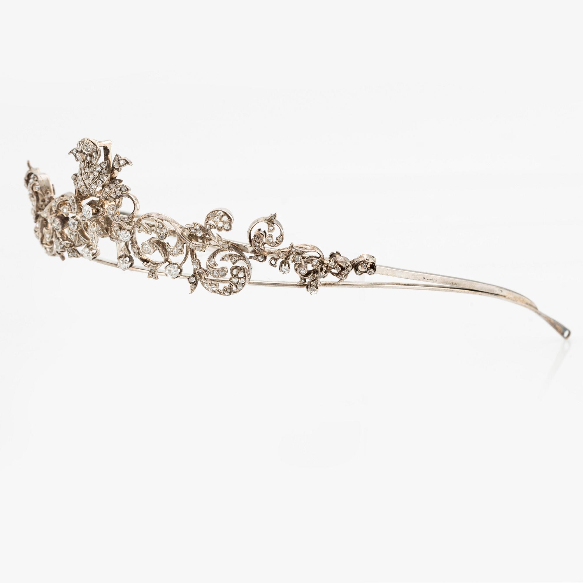 An 18K gold and silver tiara composed of scroll motifs set with old ...