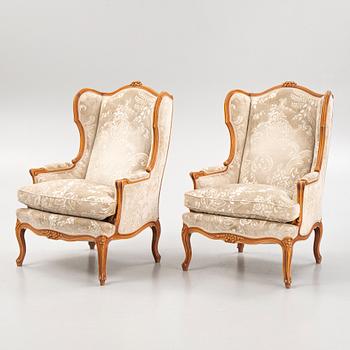A pair of Rococo style armchairs, first half of the 20th century ...