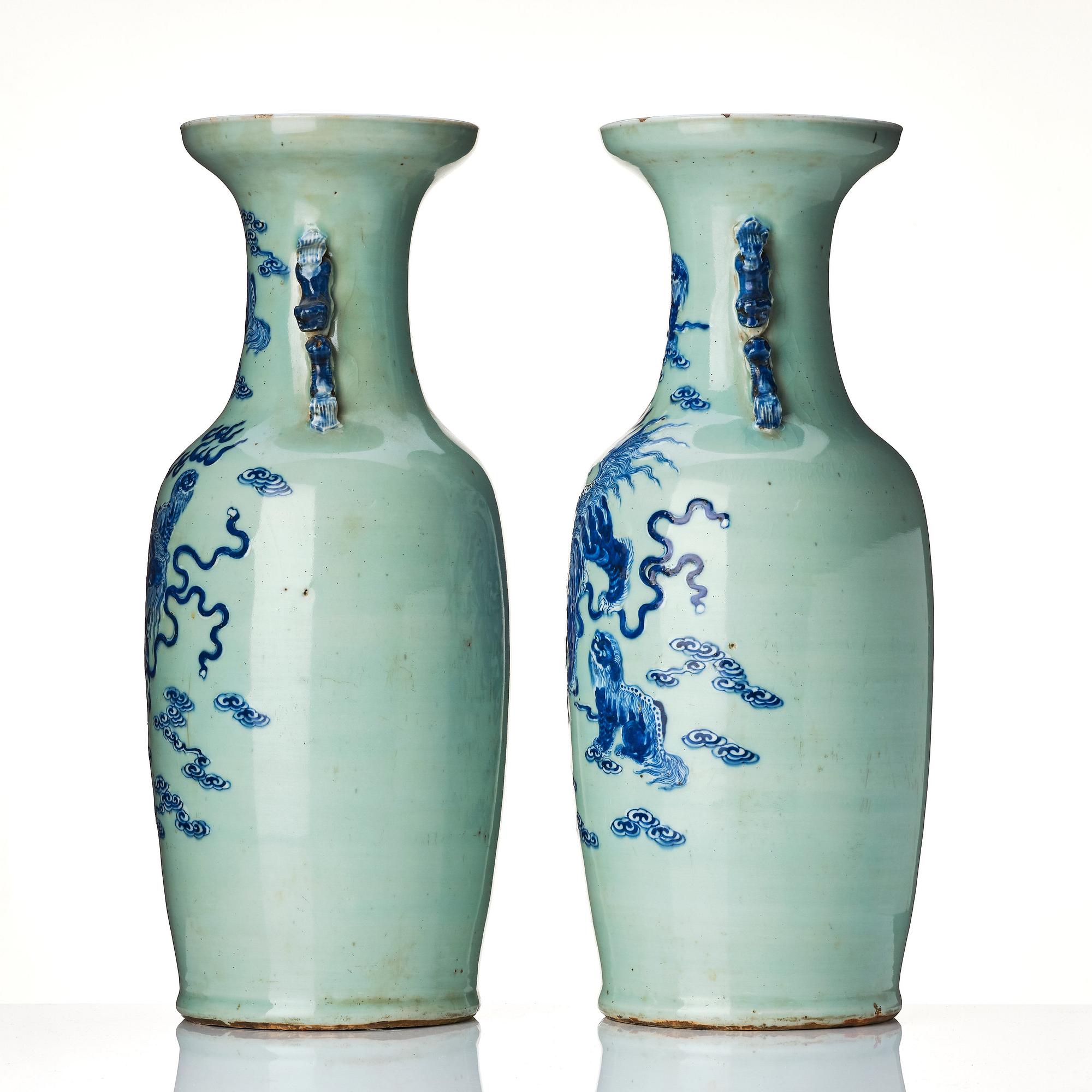 A pair of blue and white vases with celadon ground decorated with ...