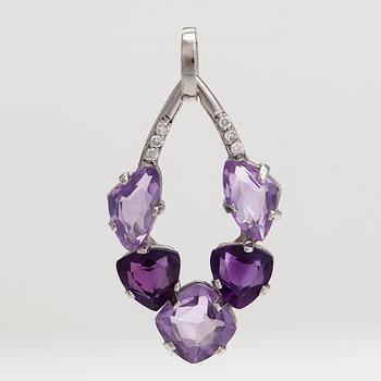 Riipus, 14K valkokultaa, timantteja yht n 0.054 ct ja ametisteja ...