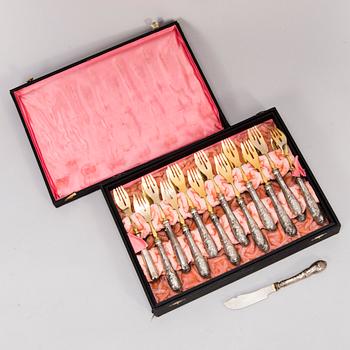 An German, early 20th Century set of 23 cake forks and additional ...