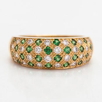 An 18K gold ring, with pavé-set tsavorite garnets and brilliant-cut ...