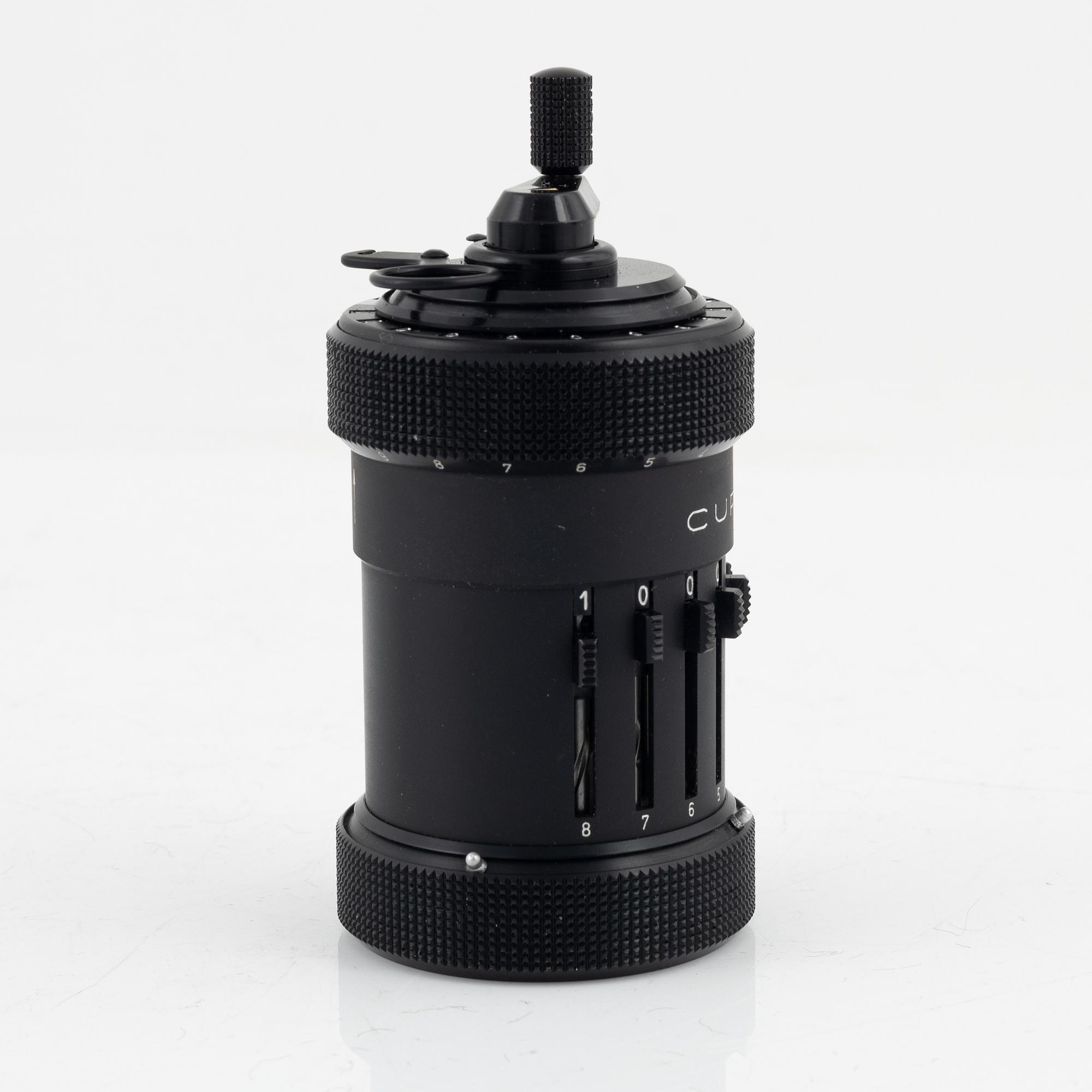 A Curta Type I mechanical calculator. - Bukowskis