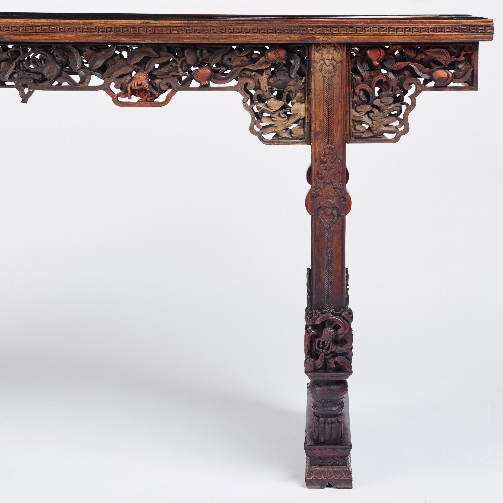 A massive zitan recessed-leg long table 'Jiaotousun Qiotouan', Qing ...