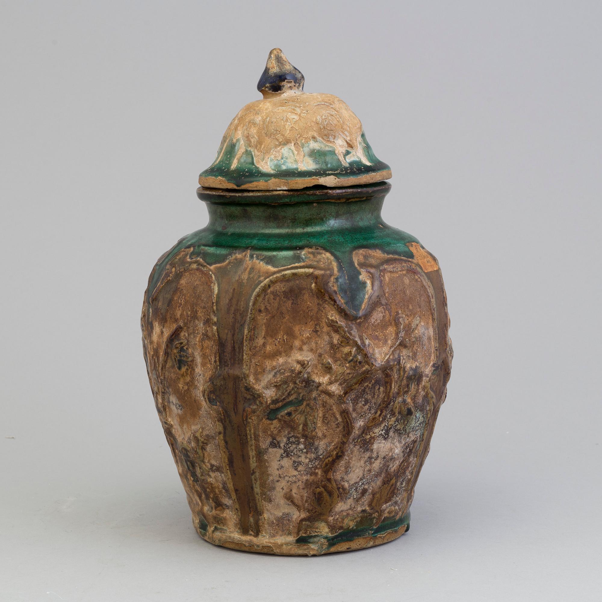 A Chinese 'Shiwan' ware pottery jar with cover, Qing dynasty, 19th ...