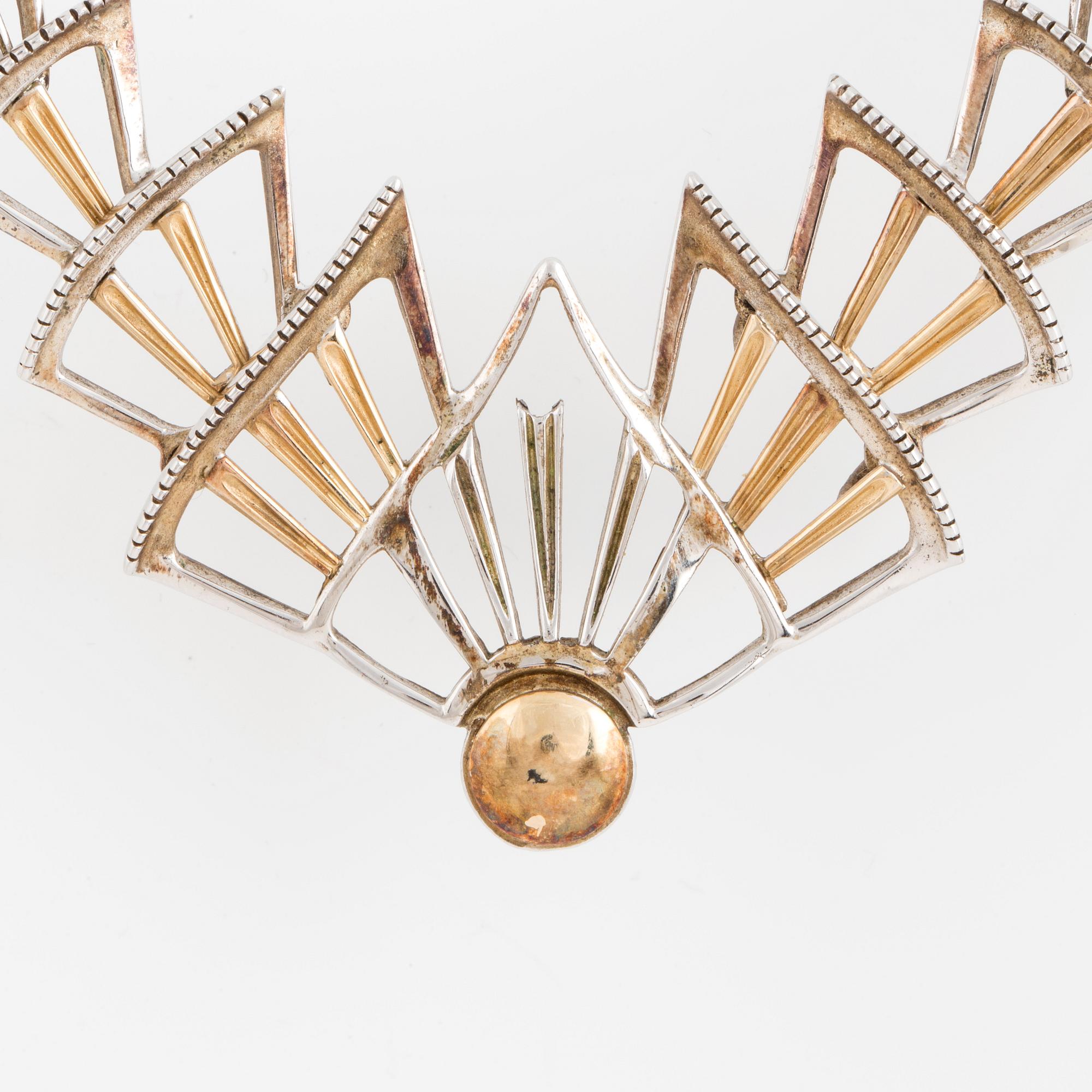 An ERTE necklace with a detachable pendant wearble as a brooch. - Bukowskis