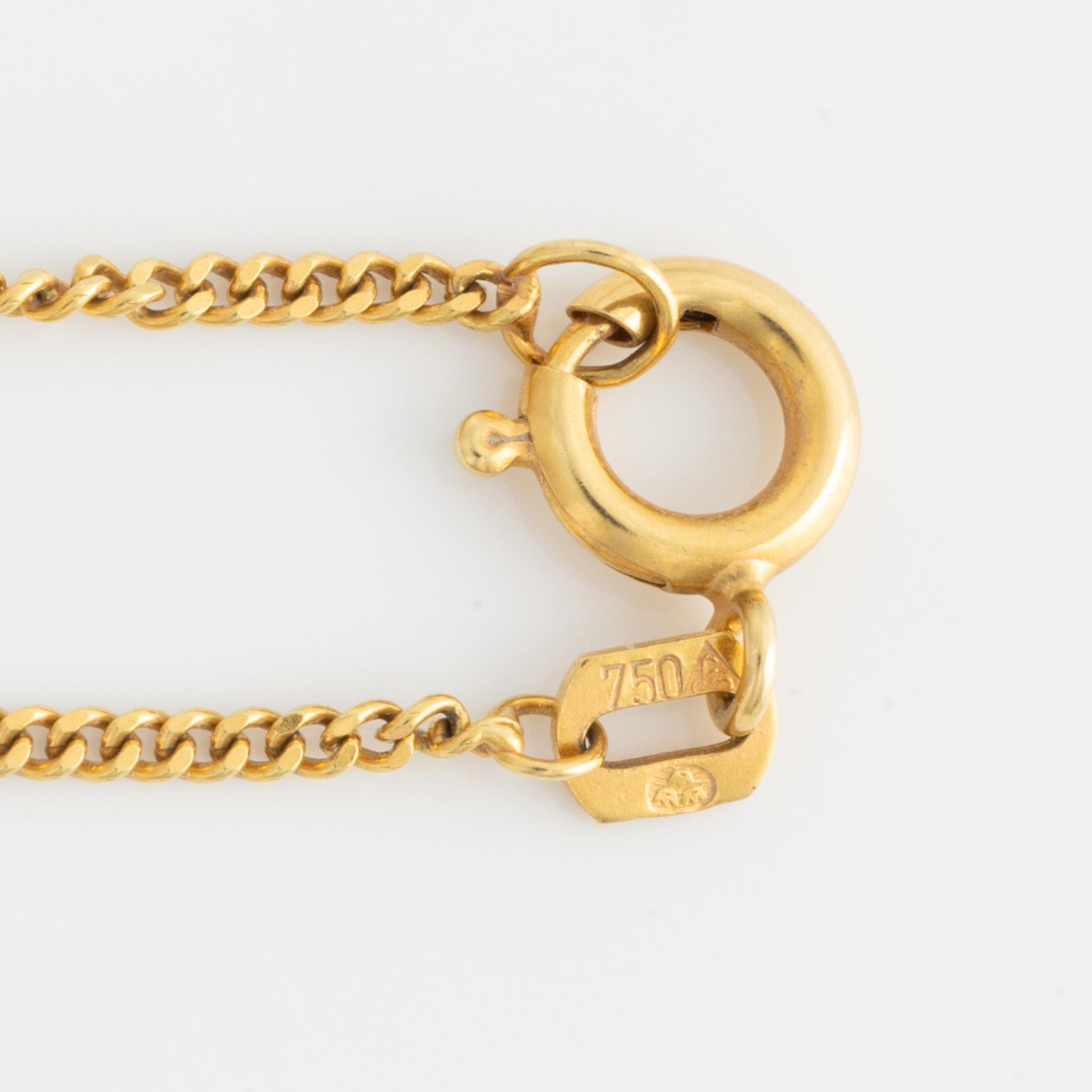 Pendant, Bengt Hallberg, 18K gold with red stone, replica of Viking jewelry. - Bukowskis