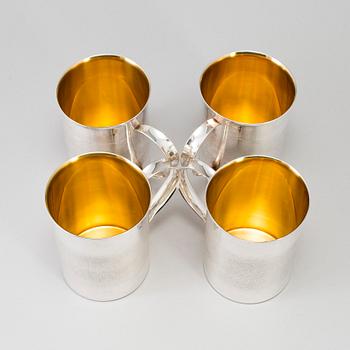 a set of four partly gilded sterling silver beer glasses by KE Palmberg ...