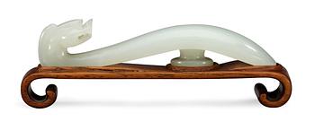 A Chinese jade belt clasper. - Bukowskis