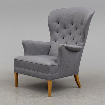 An easy chair and foot stool by Frits Hansen for Carl Hansen & Son ...