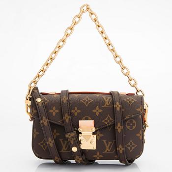 Louis Vuitton, a Monogram Canvas "Pochette Métis East West" bag ...