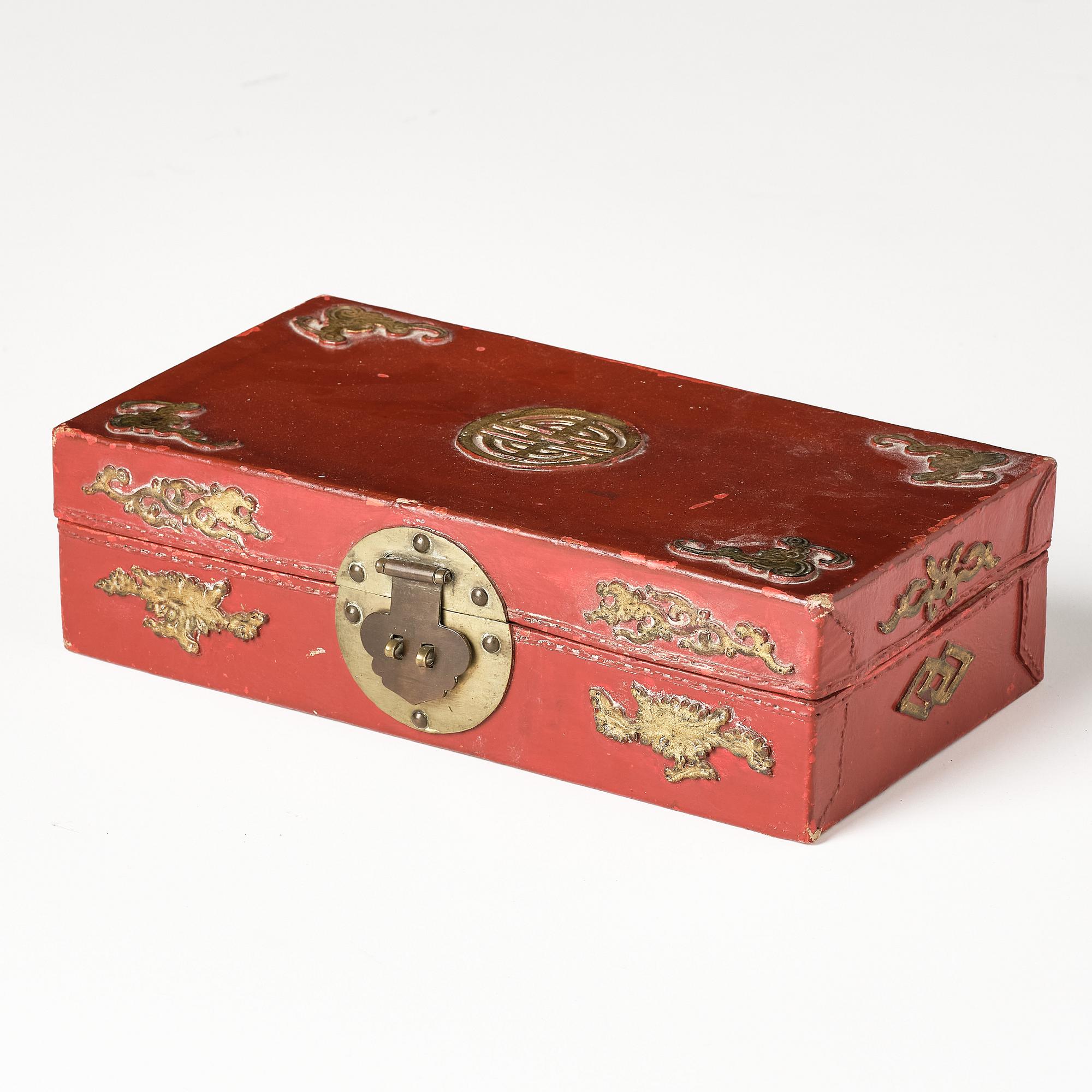 A set of two gilt decorated leather clad wooden chests, late Qing ...