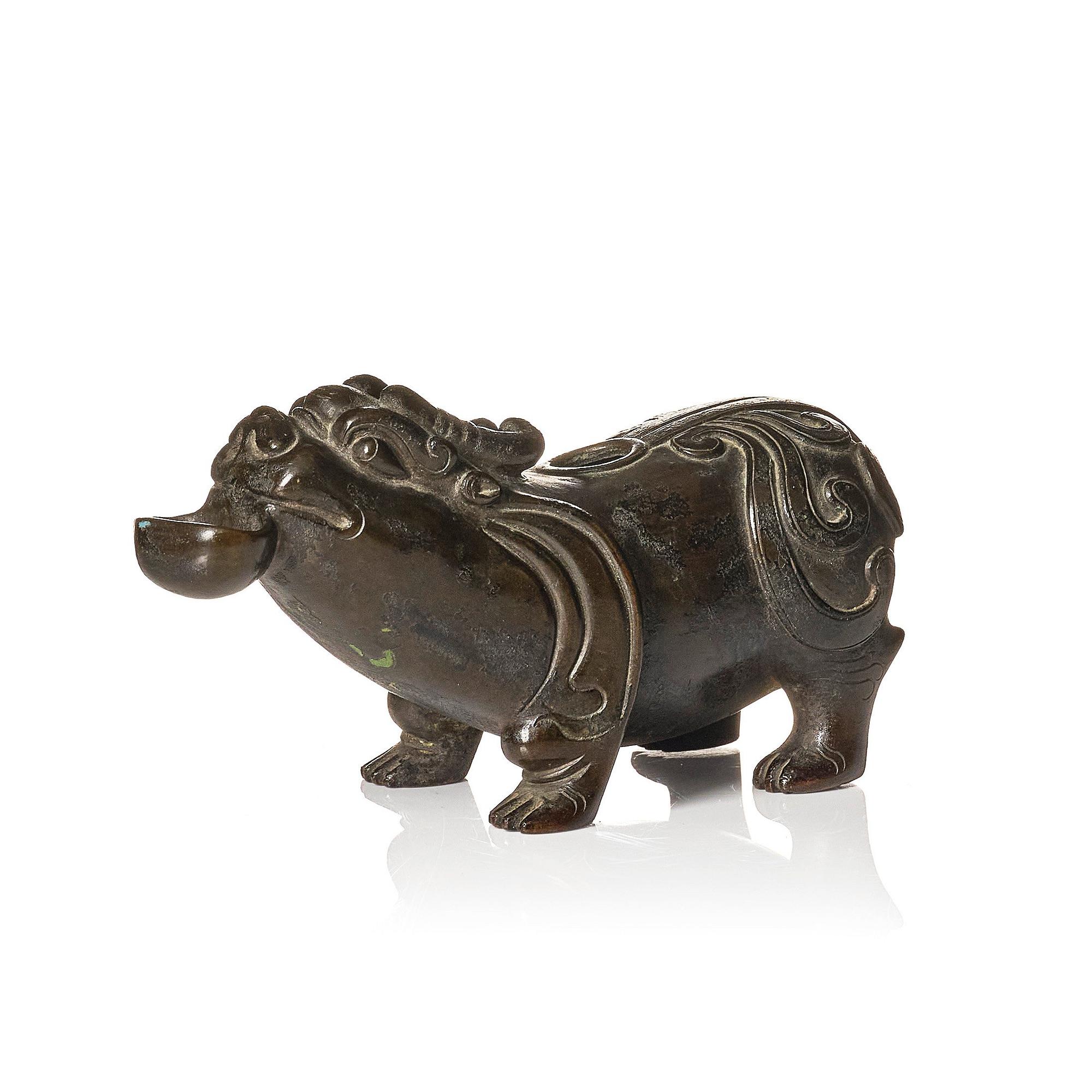 A bronze vessel in the shape of a mythical creature, late Ming dynasty ...