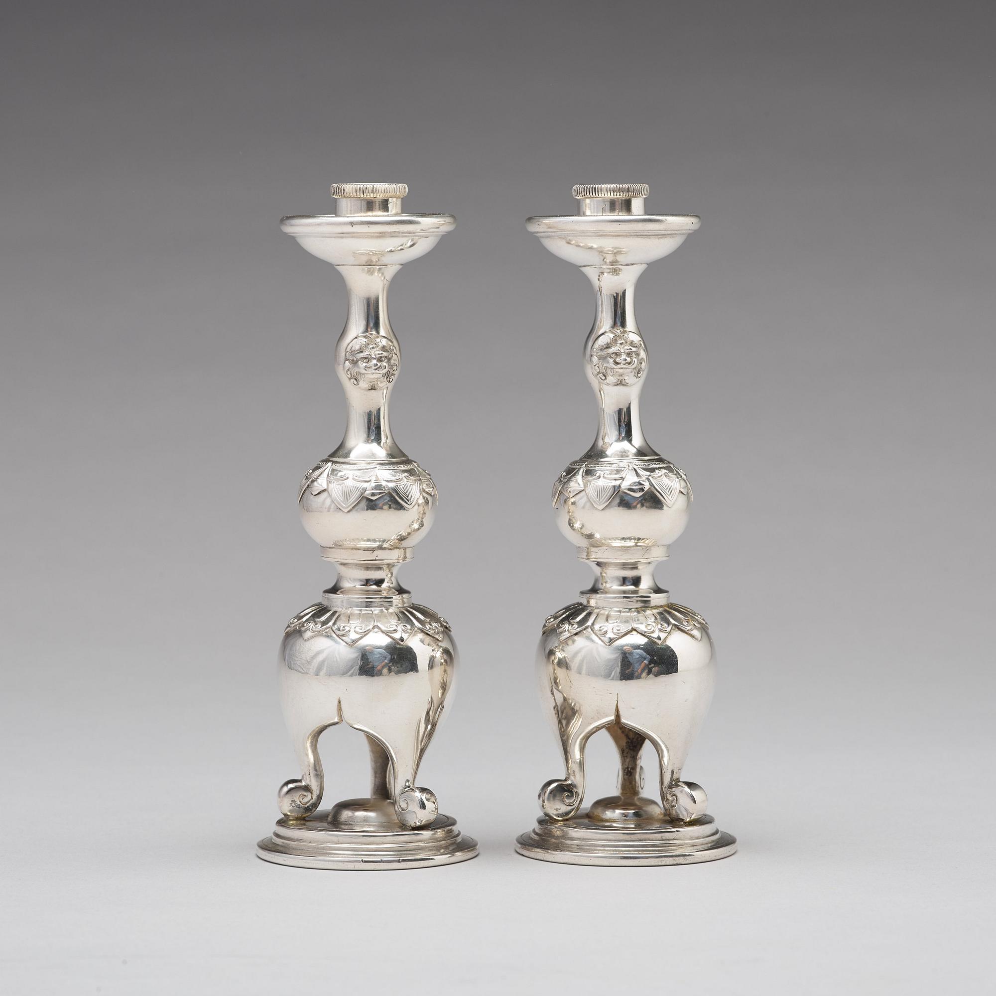 A pair of Chinese silver candle sticks, Shanghai, early 20th Century ...