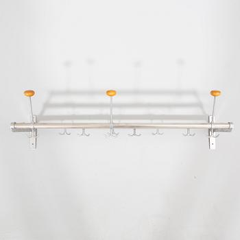 Gunnar Bolin, hat shelf in steel with wooden knobs. - Bukowskis
