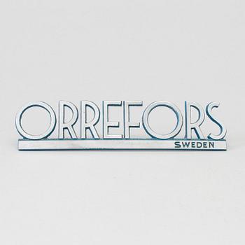 A Orrefors aluminum sign, 1930s / 40s. - Bukowskis