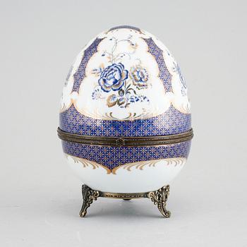 A hand painted porcelain object in form of an egg, made in Limoge in ...