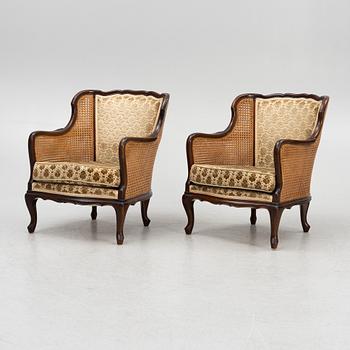 A pair of rococo style armchairs, first half of the 20th century ...
