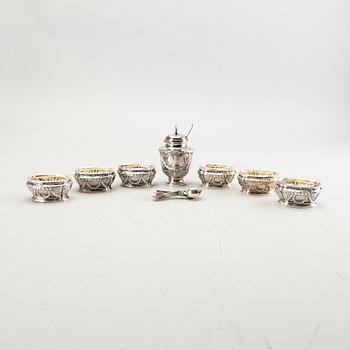 A French 20th century set of six silver saltcellars and one mustard jar ...
